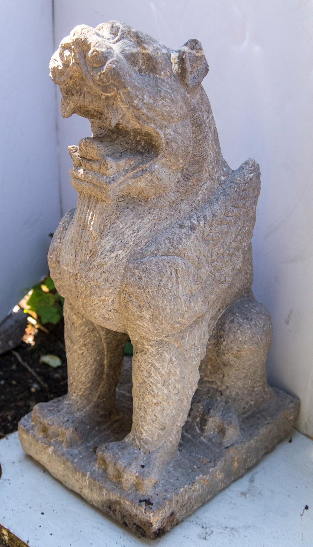 Pair of Hand Carved Stone Winged Beasts For Sale at 1stDibs