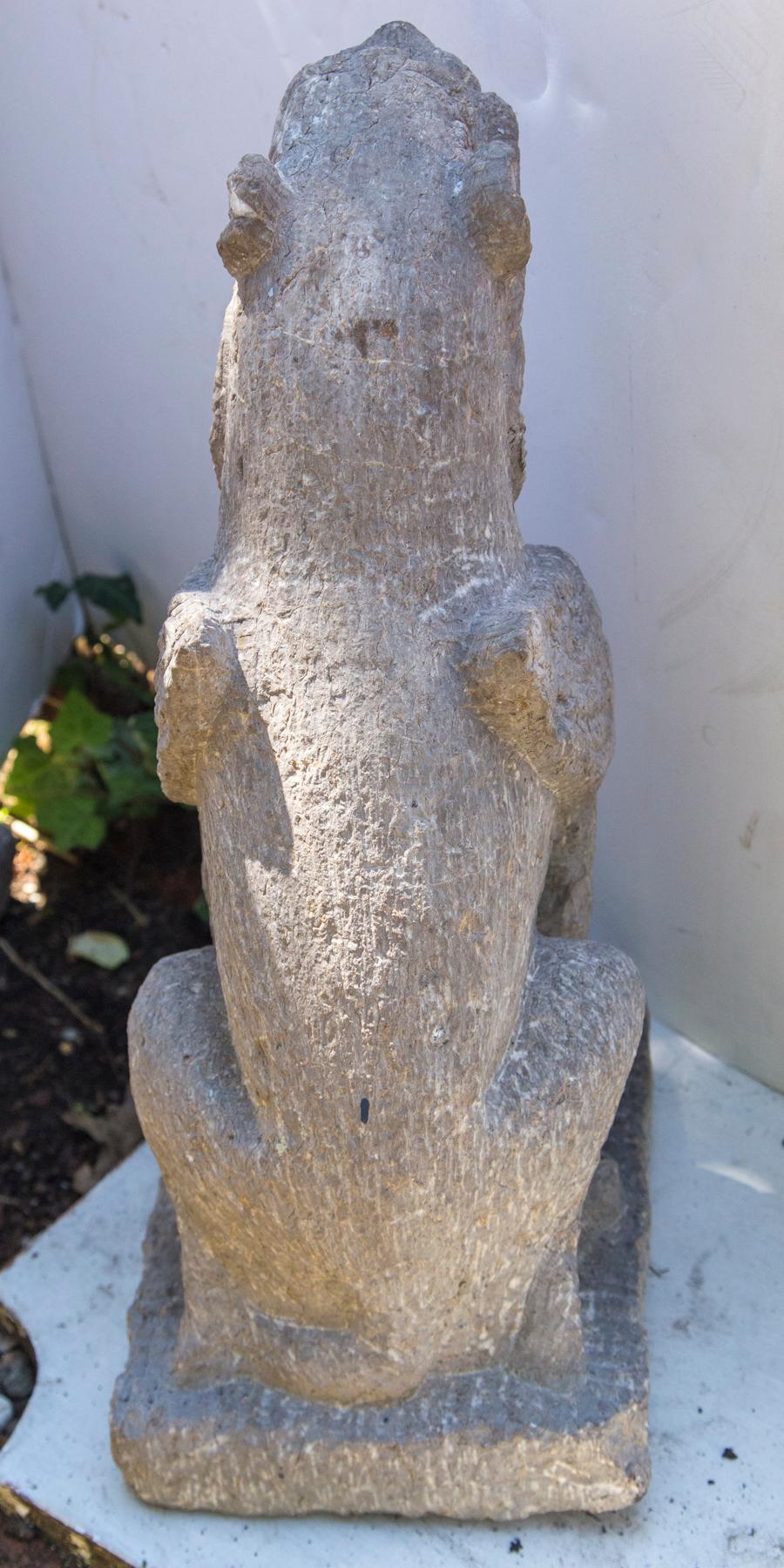Pair of Hand Carved Stone Winged Beasts For Sale at 1stDibs