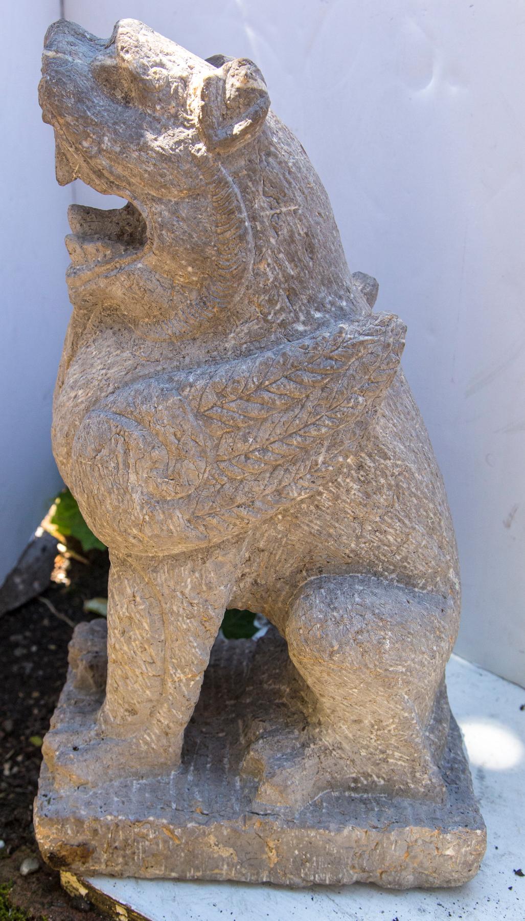 Pair of Hand Carved Stone Winged Beasts For Sale at 1stDibs