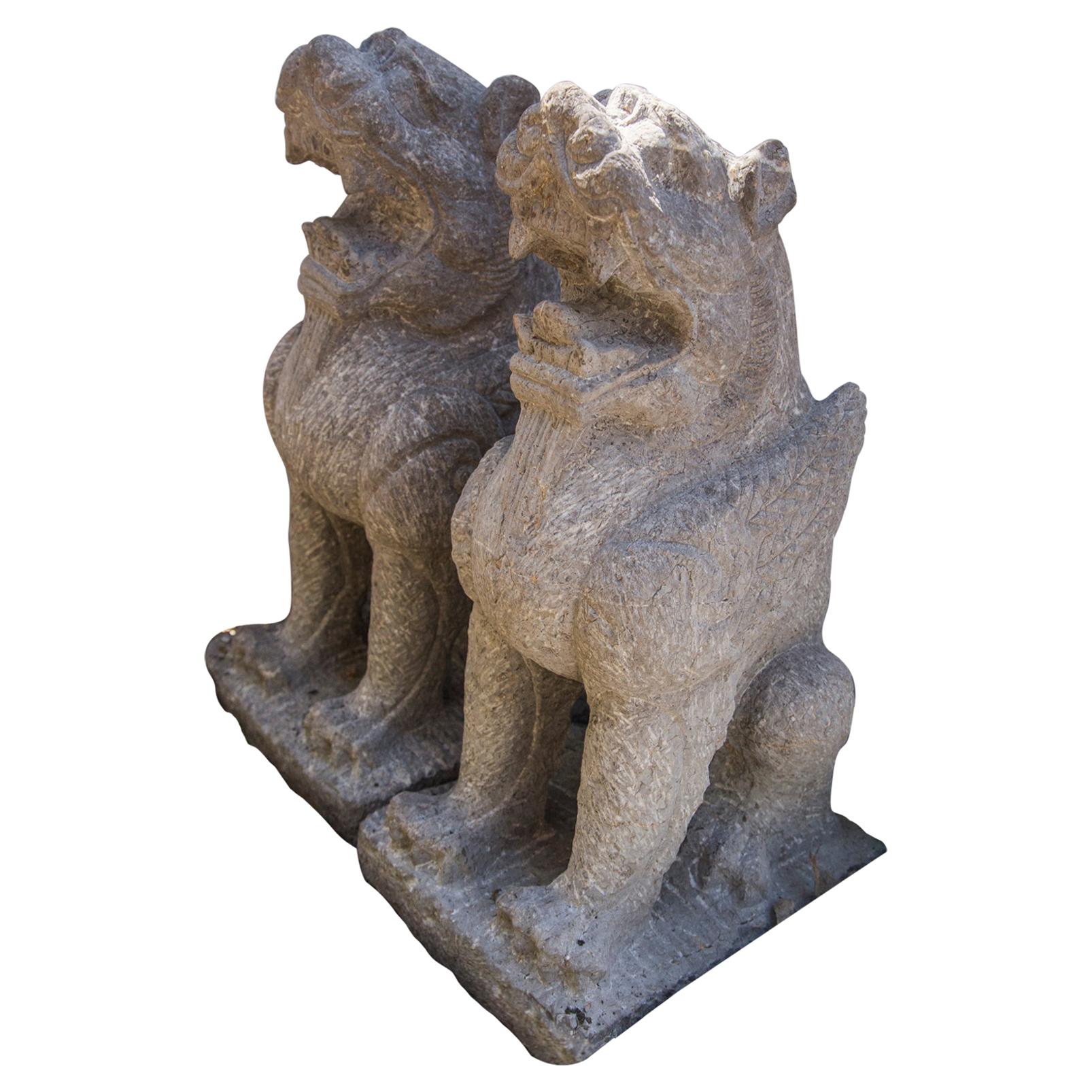 Pair of Hand Carved Stone Winged Beasts For Sale at 1stDibs