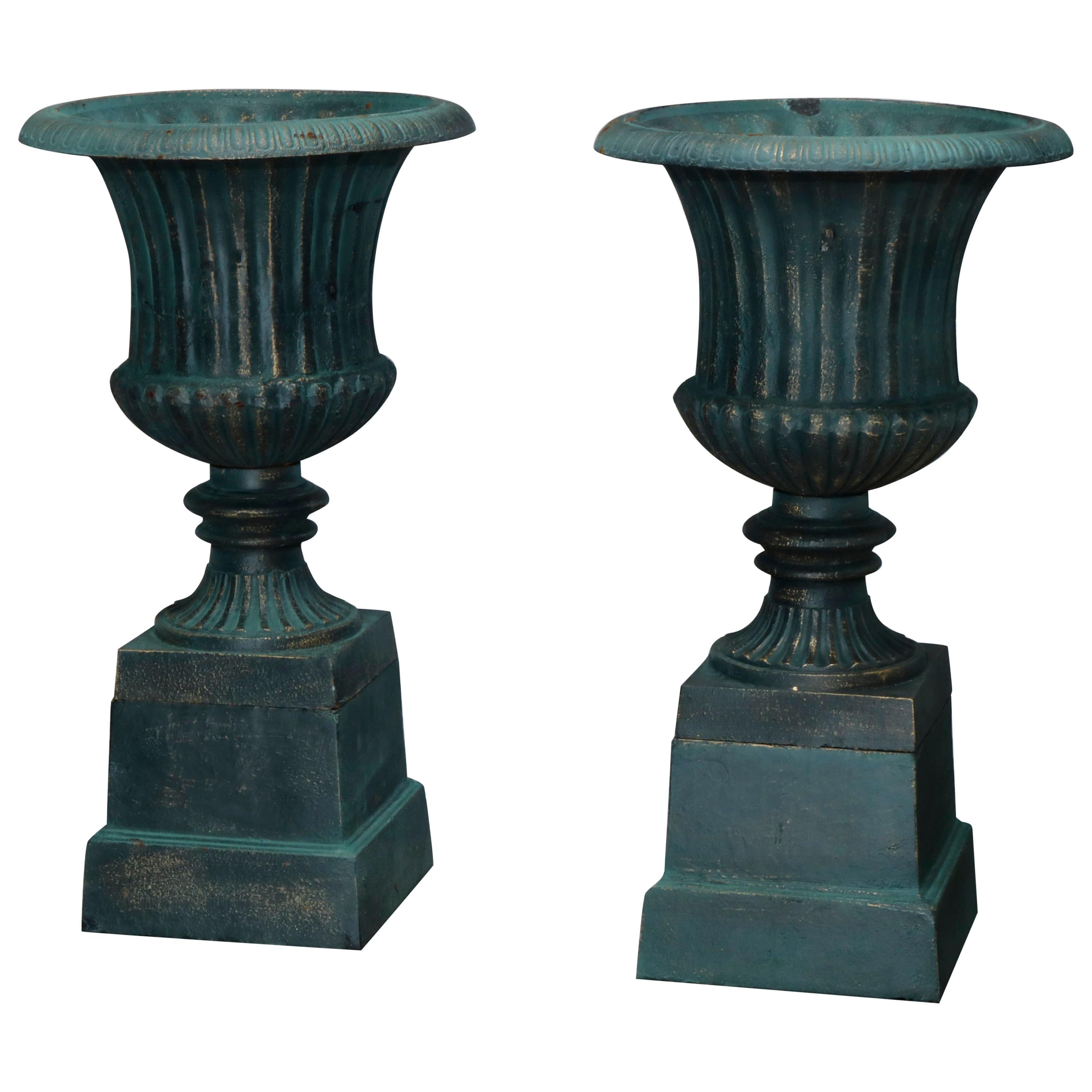 Set of Four Large English Stone Urns on Plinths at 1stDibs