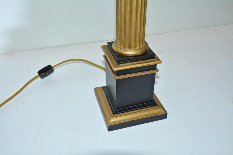 Pair of Neoclassical Gold and Black Column Lamps at 1stDibs