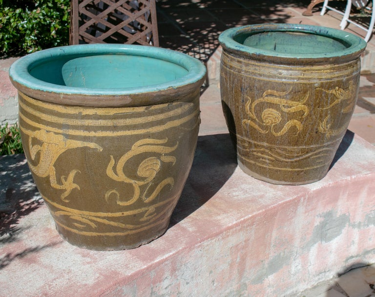 Pair of Oriental Style Ochre Colored Pots with Dragon Decoration at 1stDibs