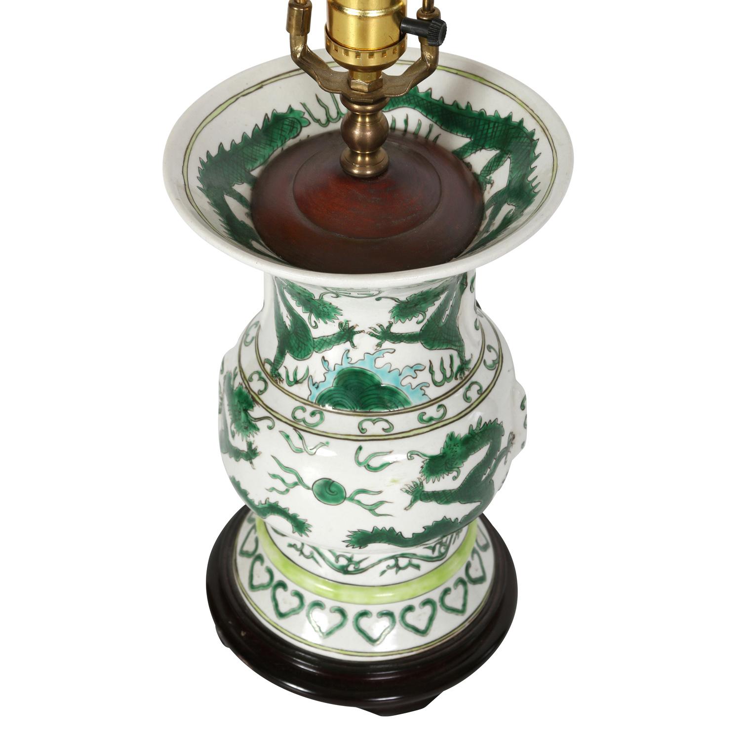 Pair of Porcelain Asian Dragon Motif Lamps on Wood Base For Sale at 1stDibs