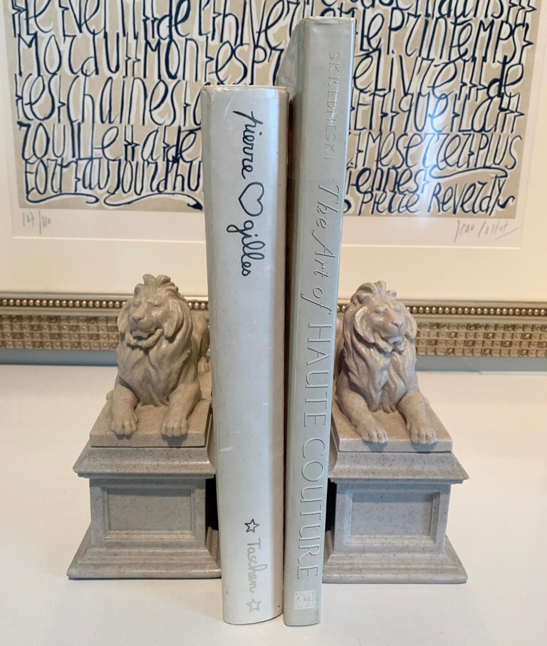 Pair of Reclining Lion Bookends For Sale at 1stDibs