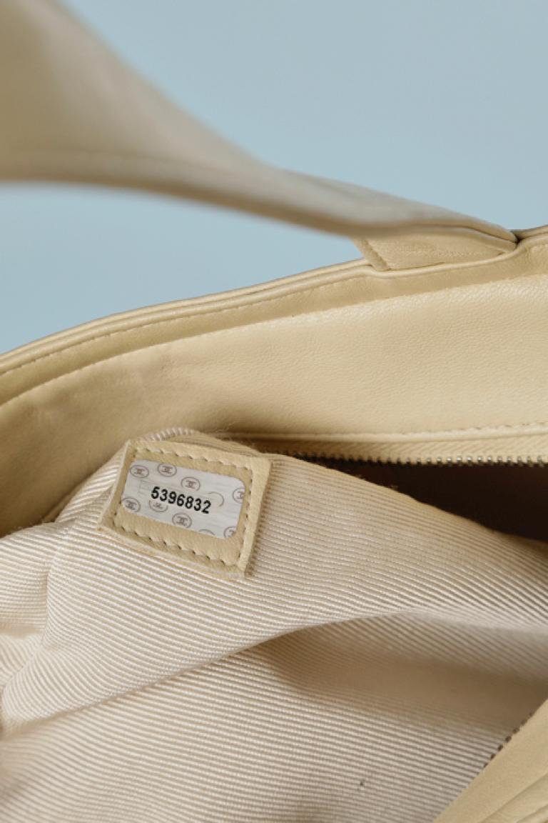Pale yellow leather hand bag with embossed "Double C" and Camelia ...