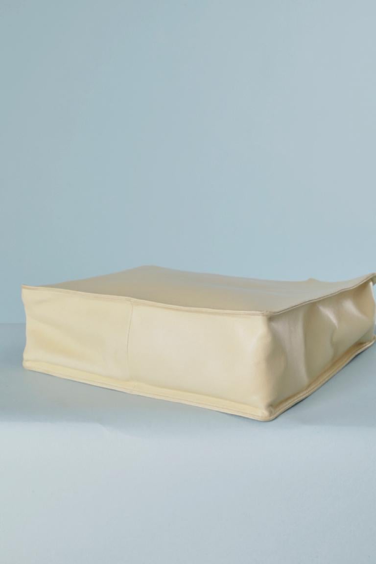 Pale yellow leather hand bag with embossed "Double C" and Camelia ...
