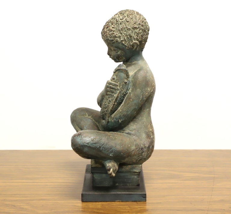 Patinated Bronze Seated Boy Holding Fish Sculpture For Sale at 1stDibs