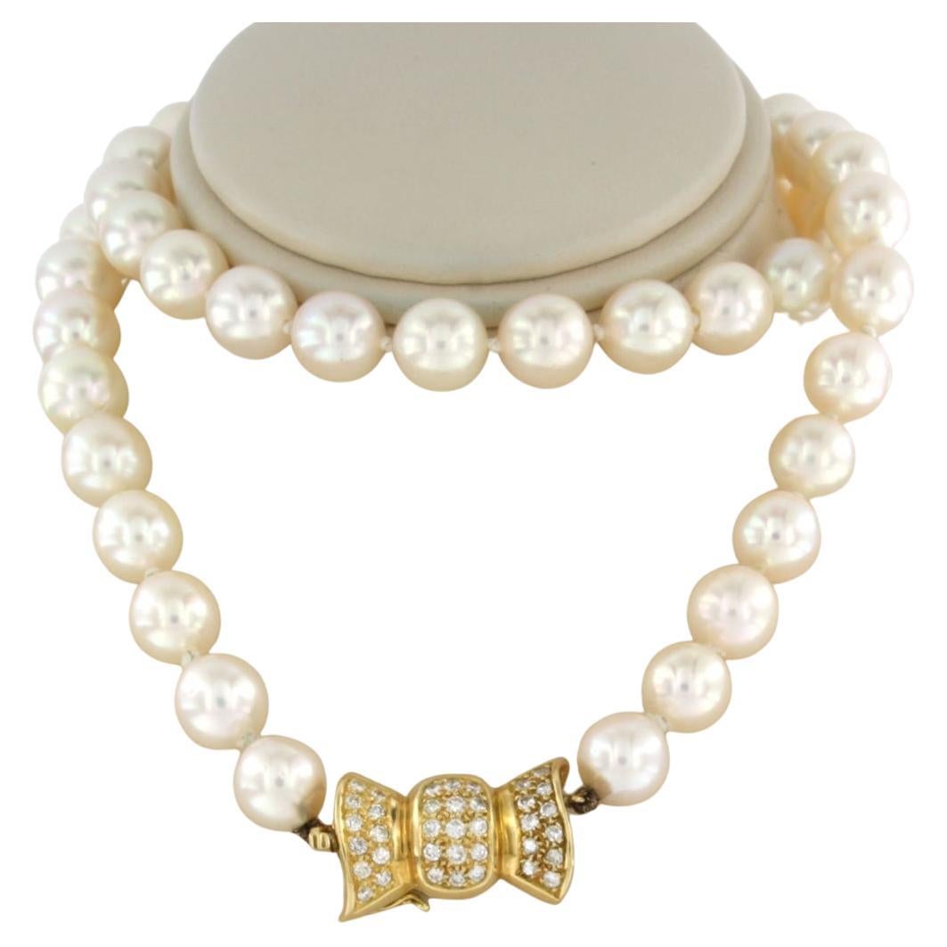 Pearl chain with lock set with ruby and diamonds 18k yellow gold and ...