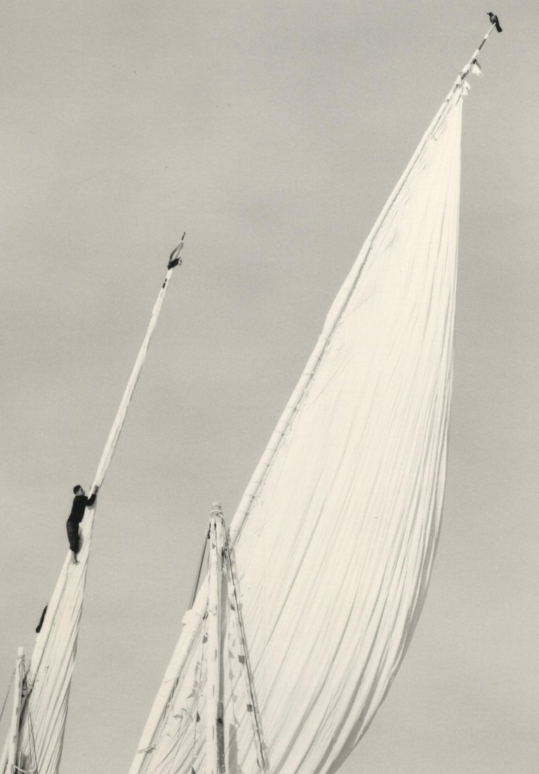 Pentti Sammallahti - Luxor, Egypt (Man climbing up the mainmast of a ...