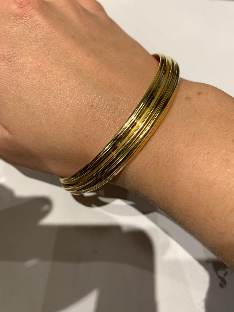 Piaget Yellow Gold Freely Spinning Possession Bangle at 1stDibs