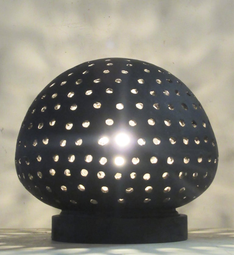 Pierced Black Ceramic Illuminating Light Sphere Lamp at 1stDibs