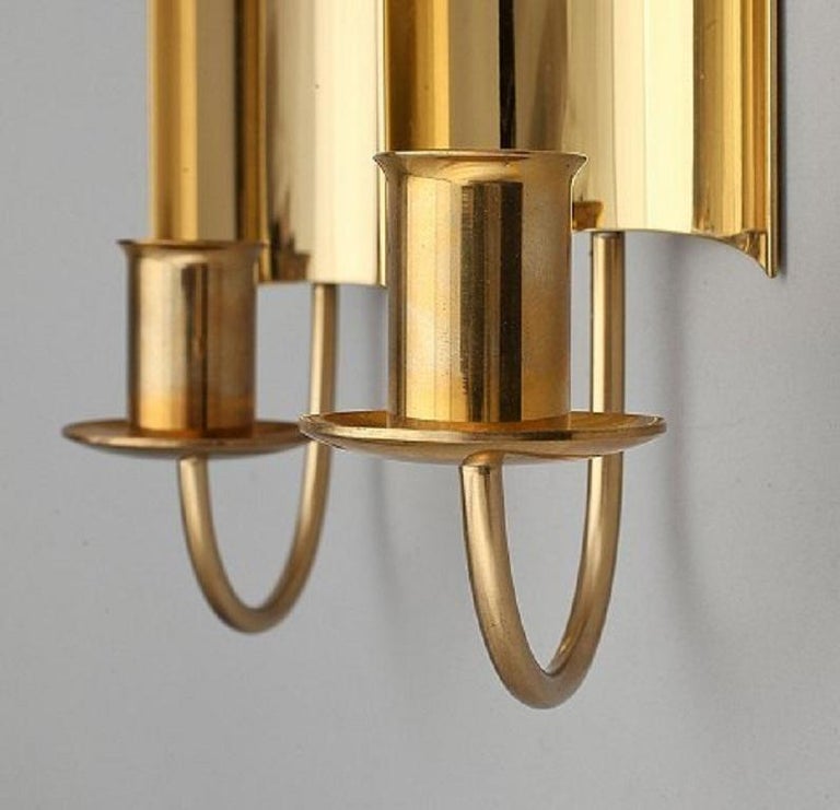 Pierre Forsell for Skultuna. Two 'Reflex' wall-mounted candlesticks in ...