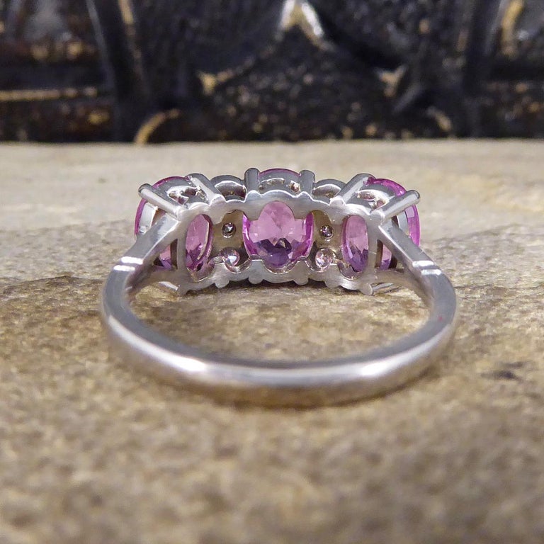 Pink Sapphire Three Stone Ring with Diamond Spacers in 18ct White Gold ...