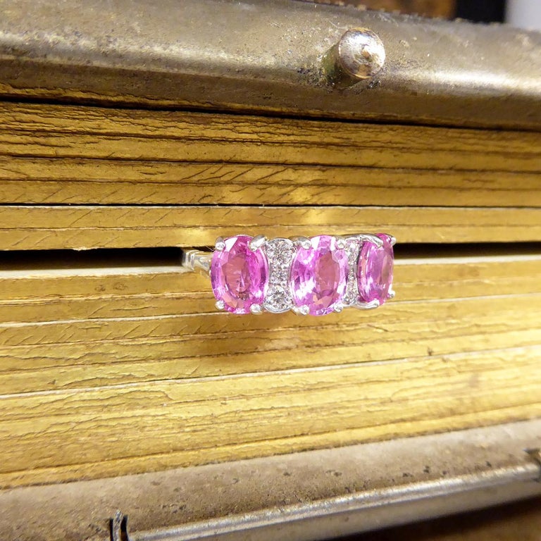 Pink Sapphire Three Stone Ring with Diamond Spacers in 18ct White Gold ...