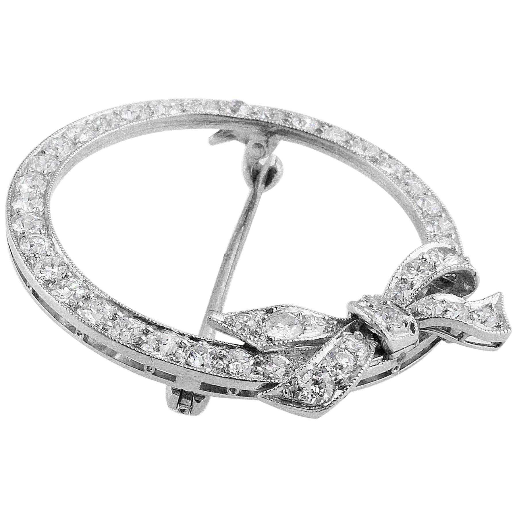 1910s Diamond Platinum Bow Brooch For Sale at 1stDibs