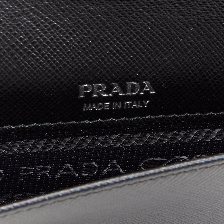 PRADA Racing Graphic Logo black saffiano flap front pocket flat top ...