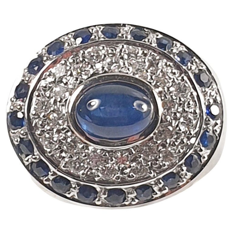 Pradera Ring with a Central Sapphire and Little Sapphires and Diamonds ...