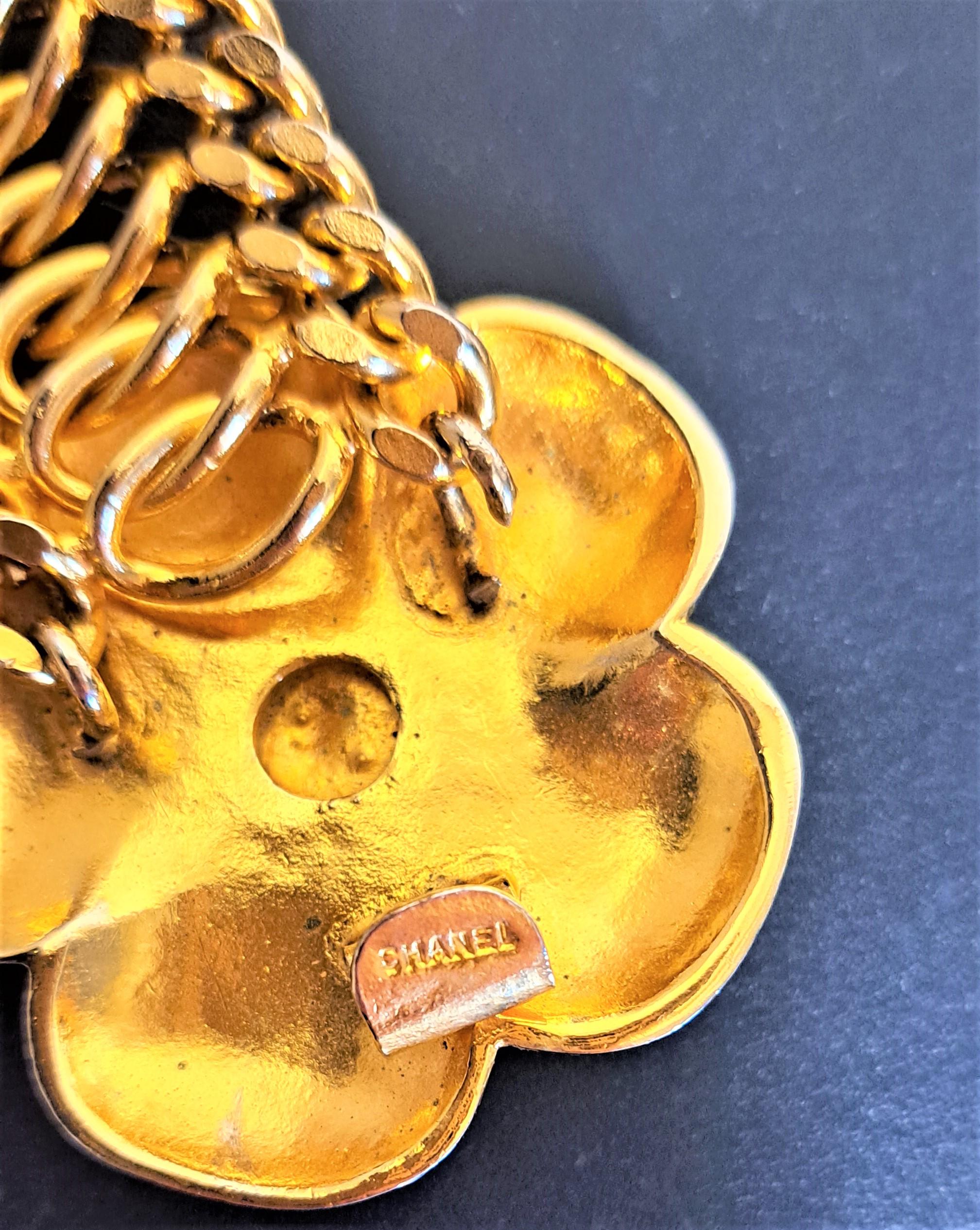Pre-loved Chanel golden belt with Camellia For Sale at 1stDibs