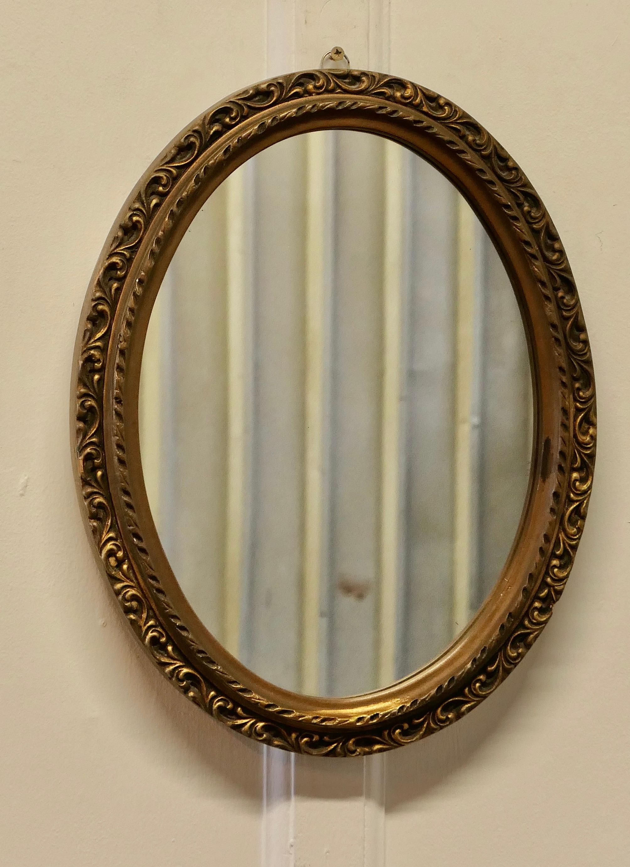 Pretty Gilt Oval Mirror This Mirror has a 2” wide deeply moulded oval ...