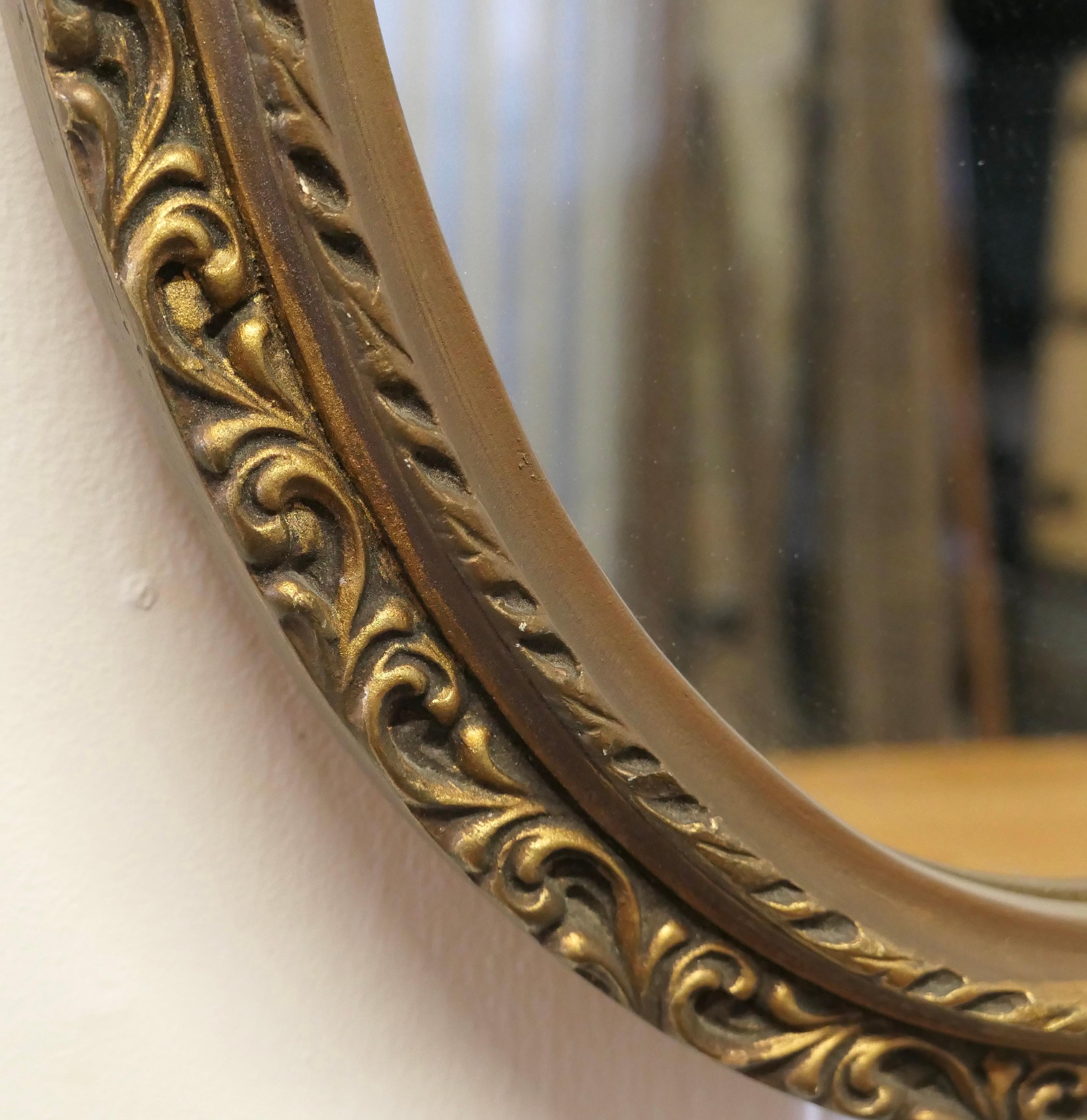 Pretty Gilt Oval Mirror This Mirror has a 2” wide deeply moulded oval ...