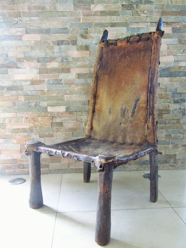 Primitive African Chair Wood and Leather, circa 1900 at 1stDibs