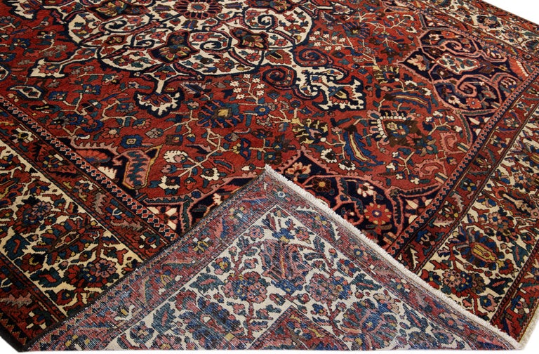 Red Handmade Antique Persian Bakhtiari Rosette Wool Rug For Sale at 1stDibs