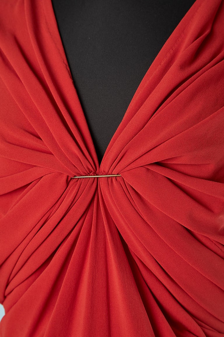 Red jersey drape cocktail dress with metalic pin in the middle front ...