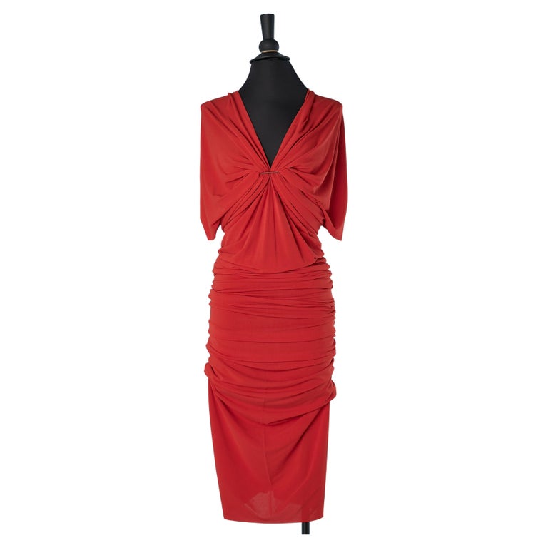 Red jersey drape cocktail dress with metalic pin in the middle front ...