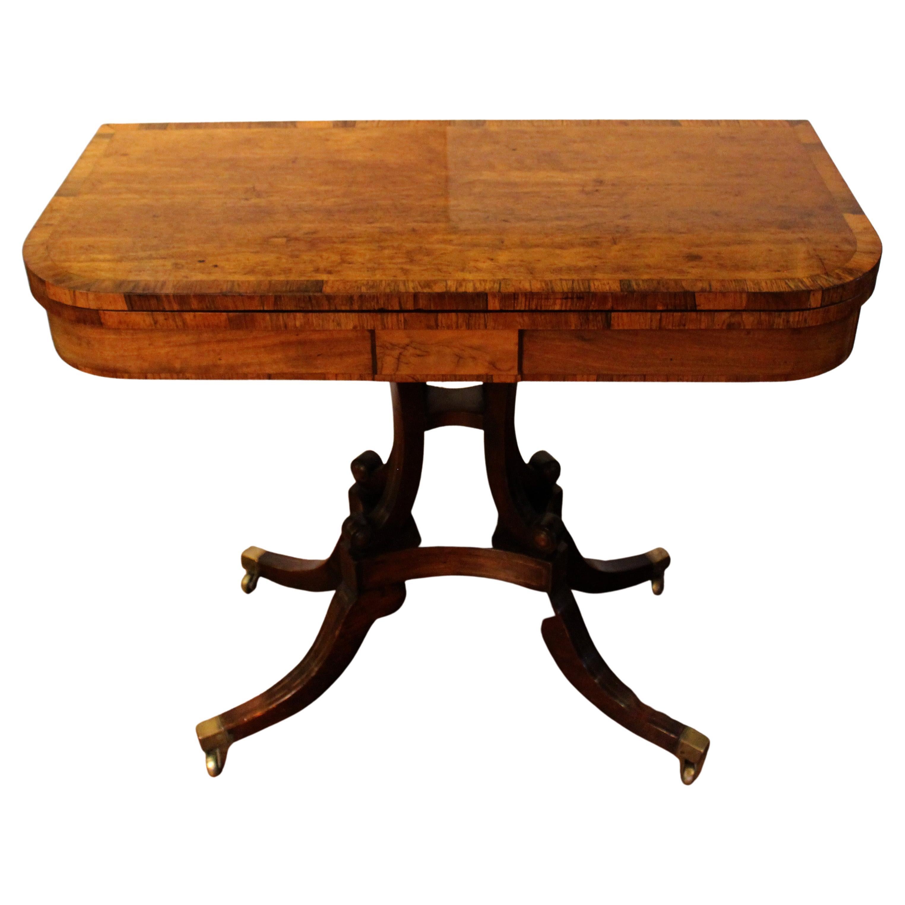 An Edwardian period ‘Centennial’ mahogany swivel and fold-over top card ...