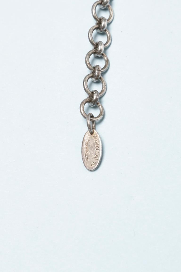 Rhinestone and patinated metal chain sautoir "On aura tout vu ...