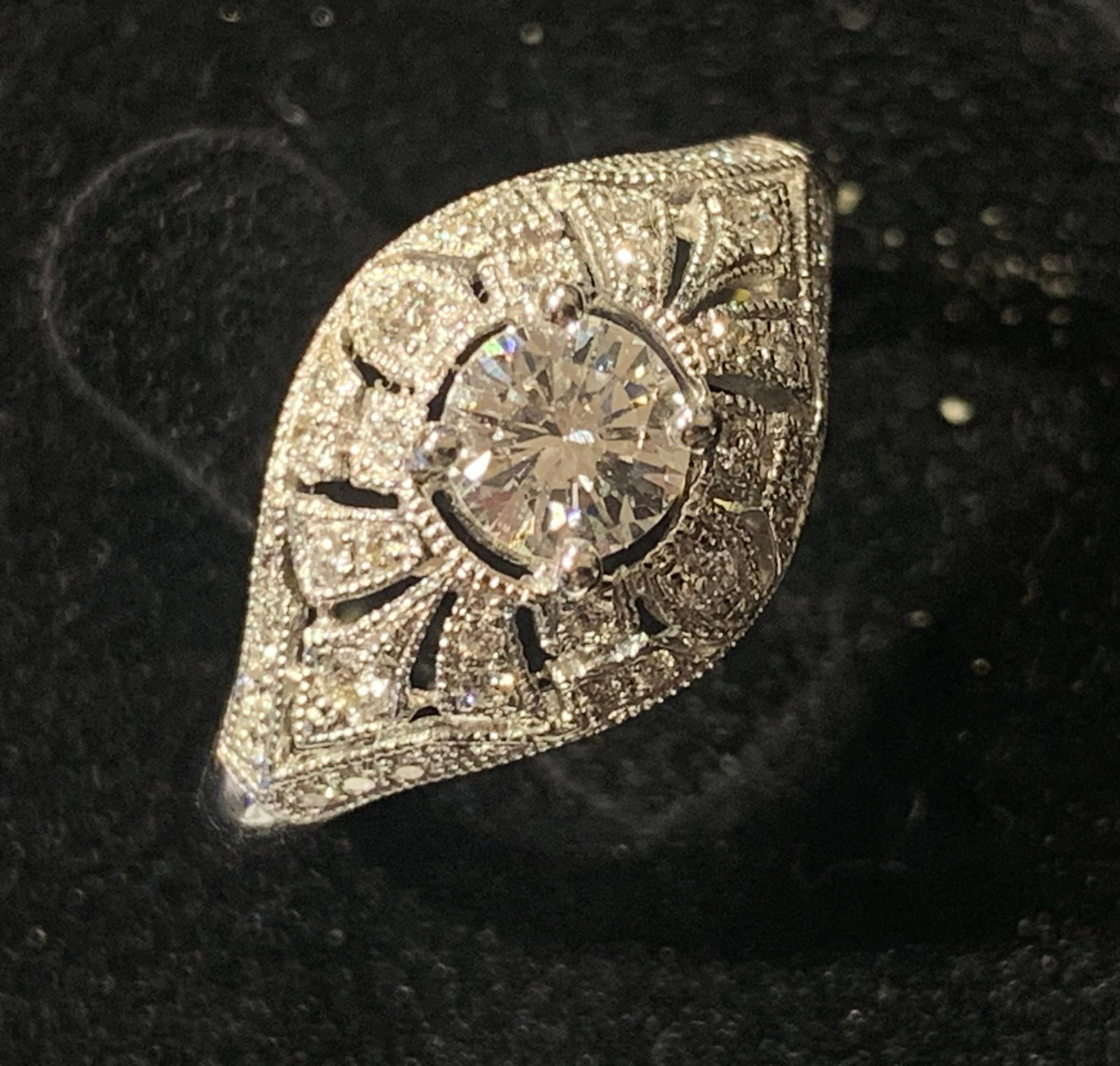 Ring in 18k White Gold Set with a Central Diamond Surrounded Paving ...