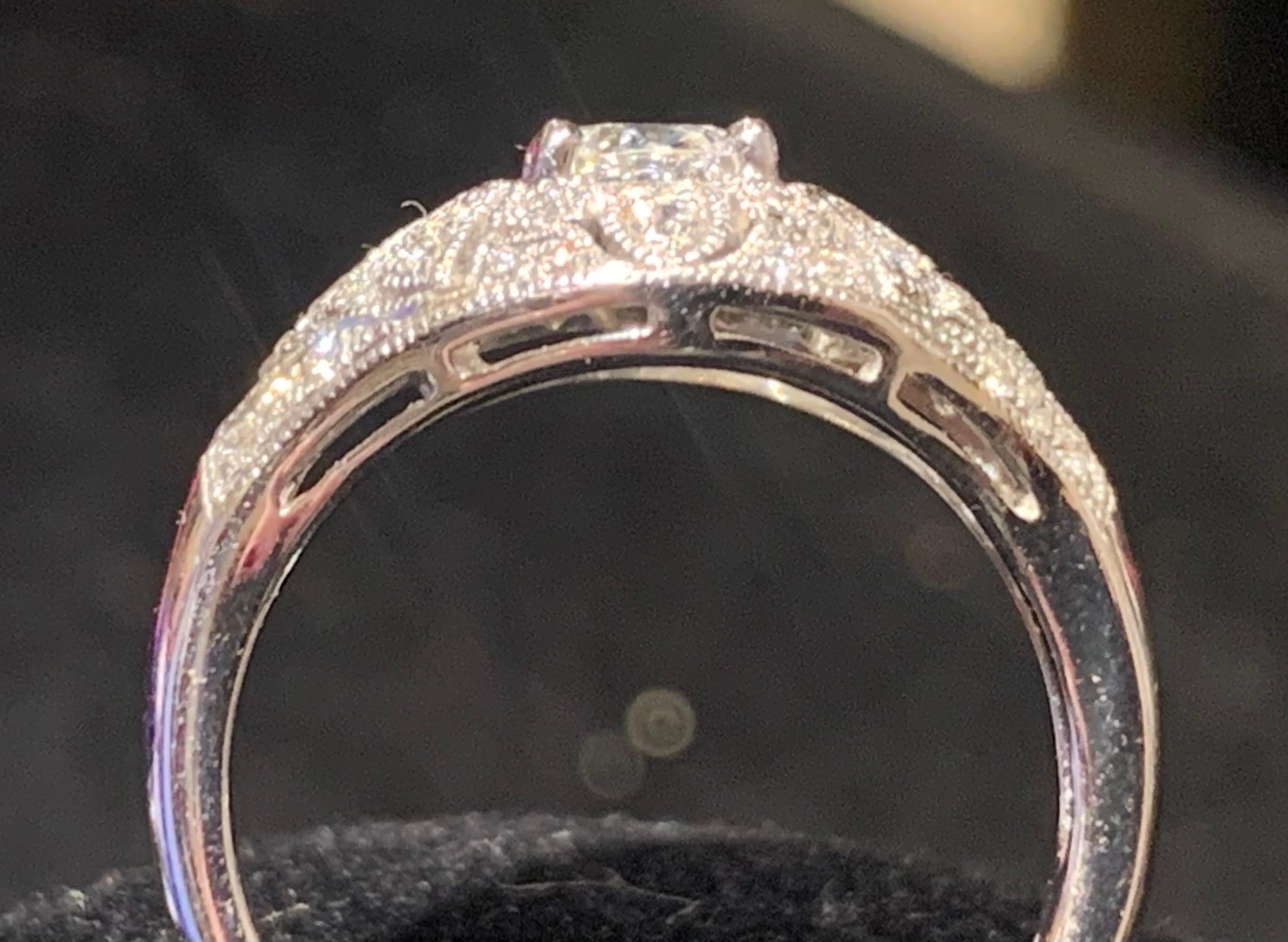 Ring in 18k White Gold Set with a Central Diamond Surrounded Paving ...