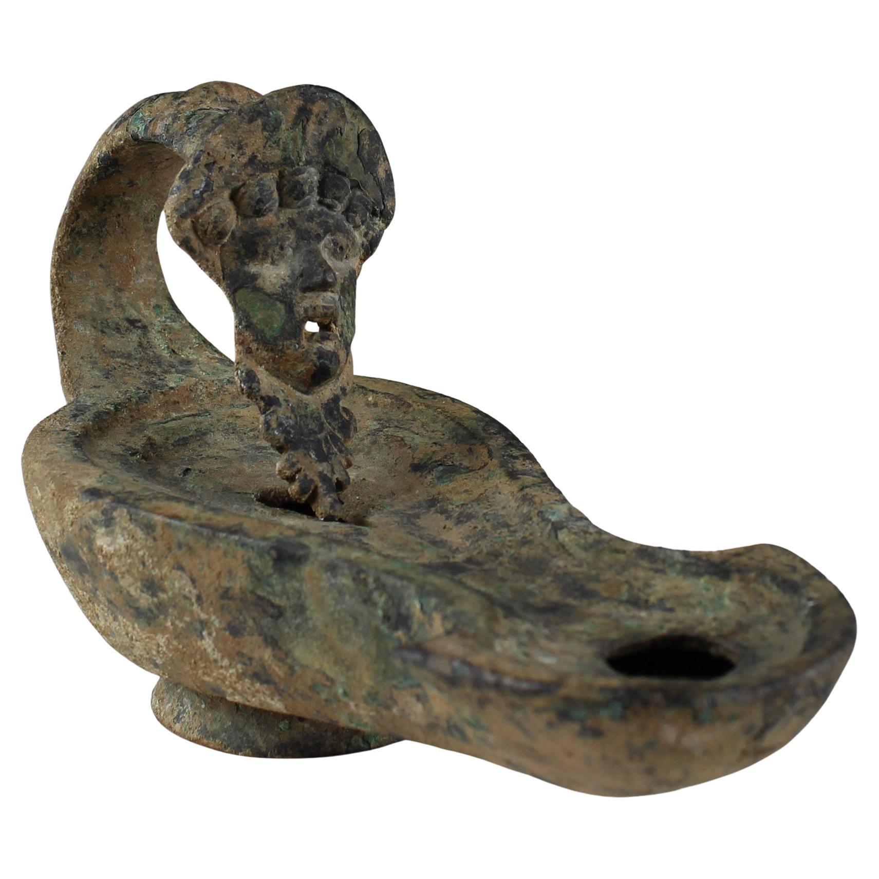 Roman oil lamp with theatre mask handle For Sale at 1stDibs