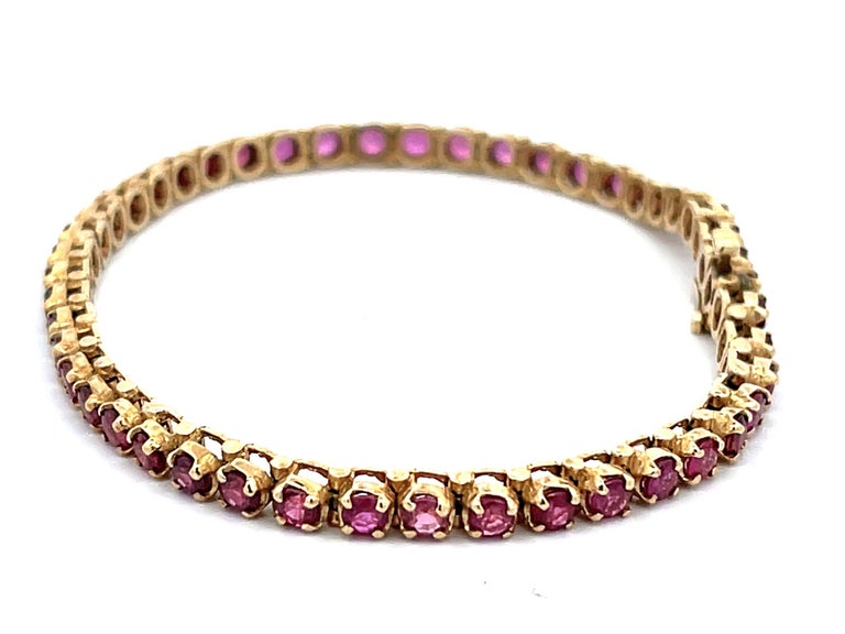 Round Red Ruby Tennis Bracelet in 14k Yellow Gold For Sale at 1stDibs
