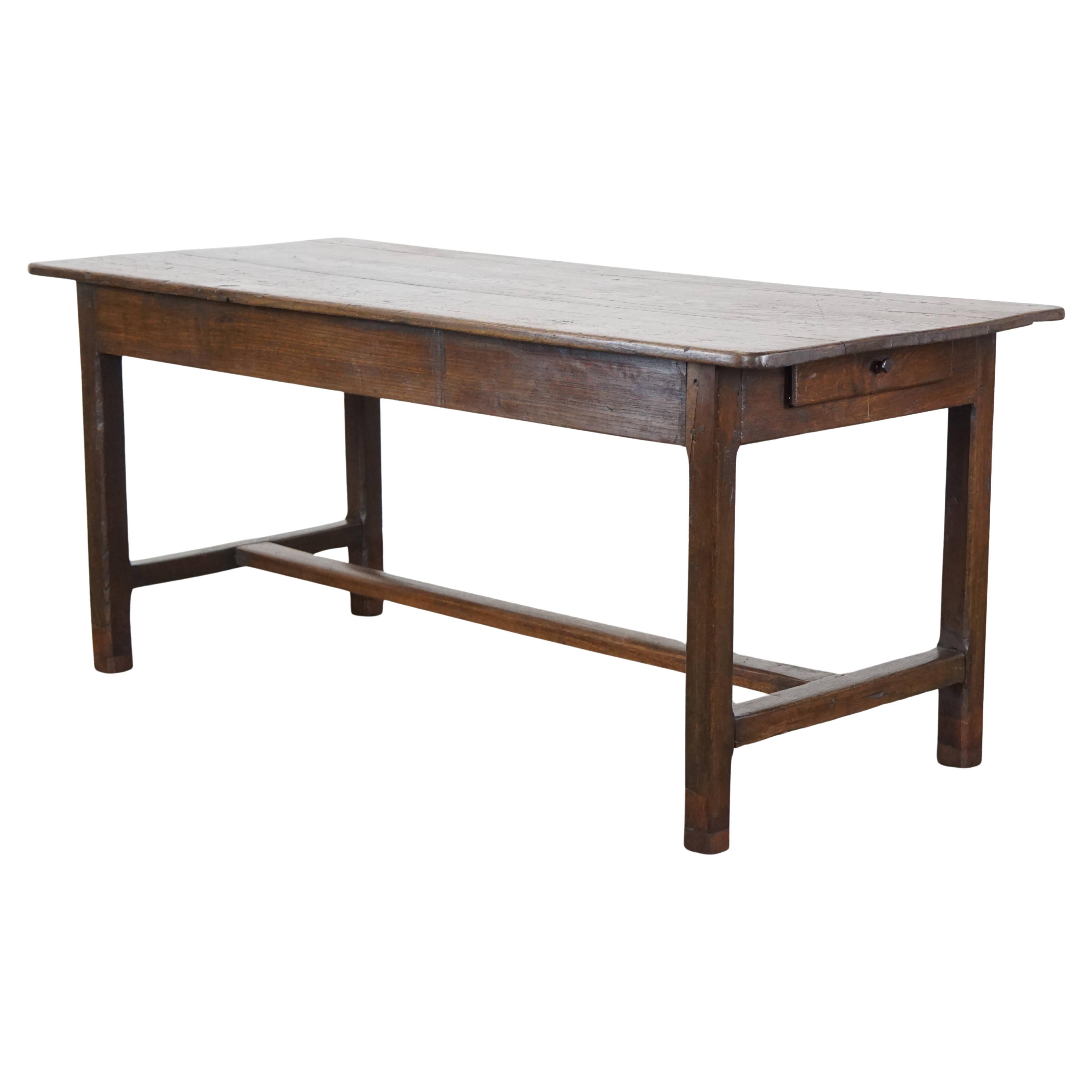 Rugged antique early 19th-century French dining table made of oak with ...