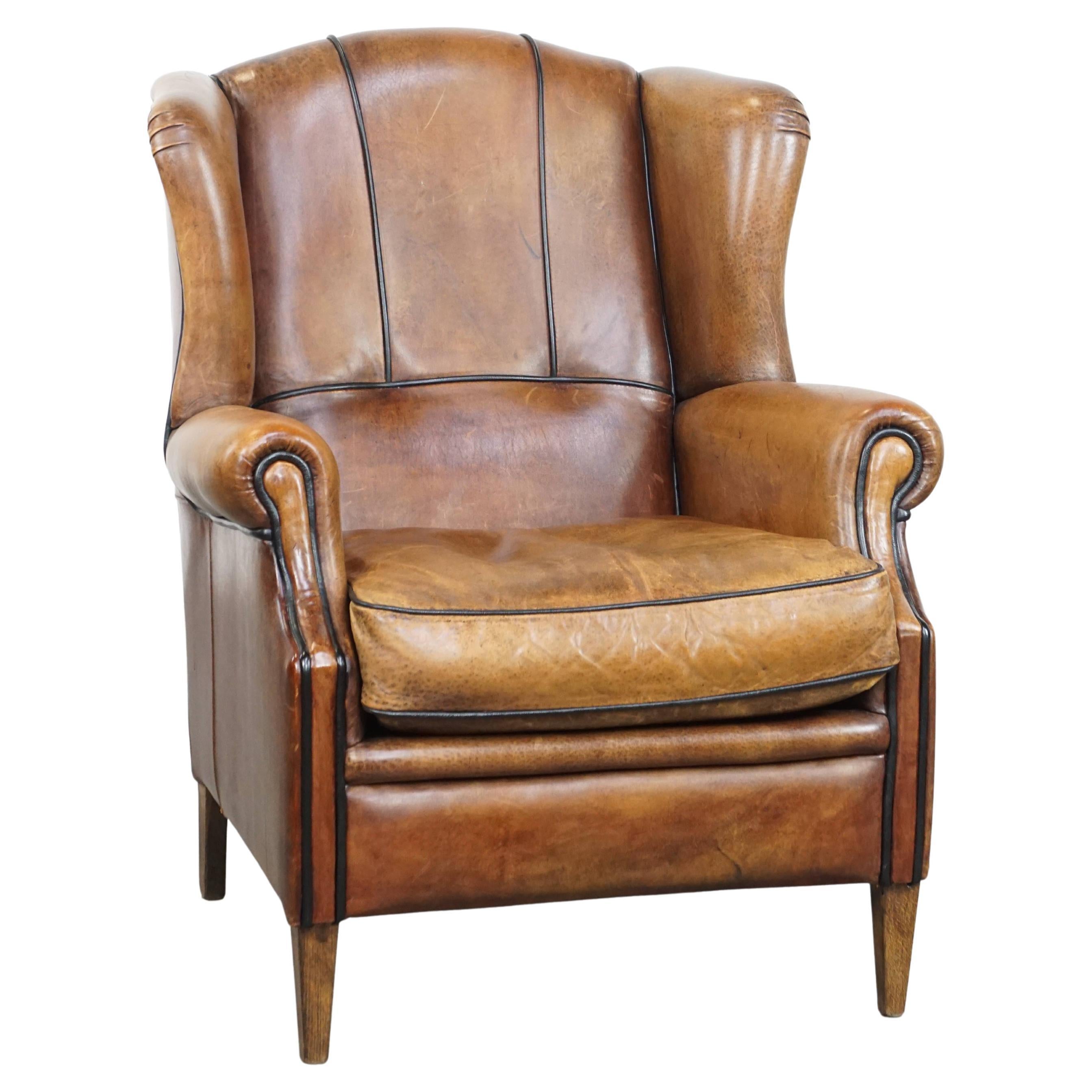 Comfortable English-style sheepskin wingback chair in a lovely deep ...