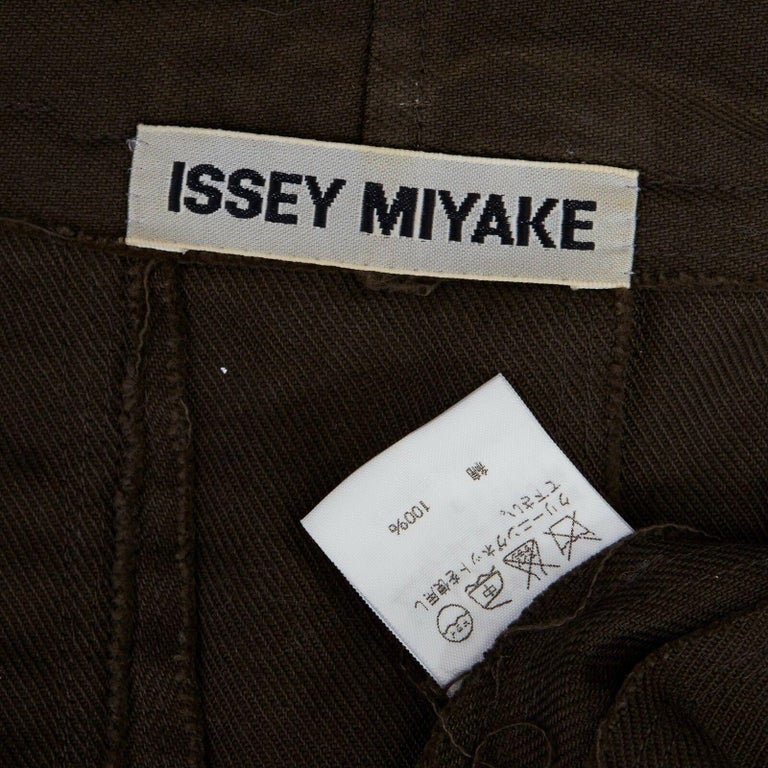 runway ISSEY MIYAKE AW2002 green deconstructed patched vest jacket top ...