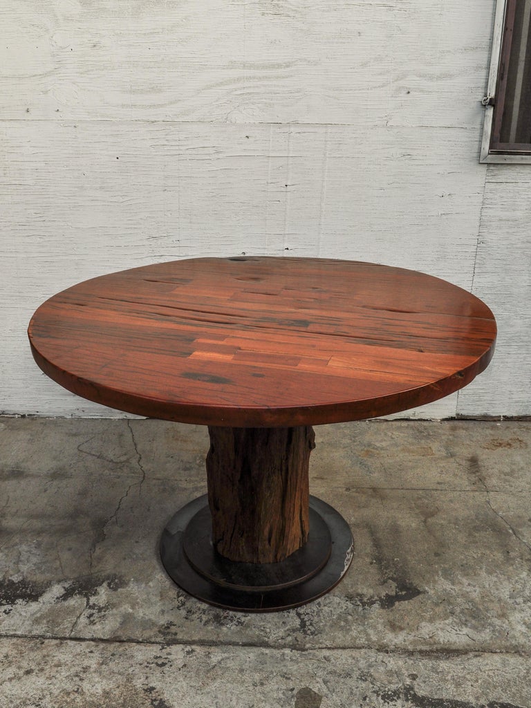 Rustic Round Table Recycled Bridge Wood with Tiered Steel Plate Base at ...