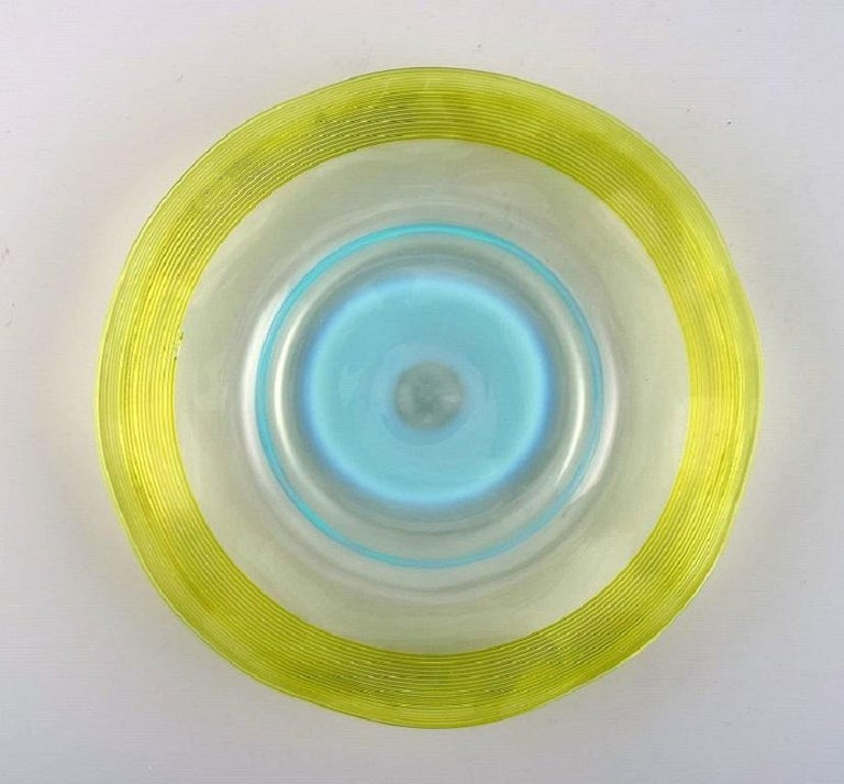 Scandinavian glass artist. Plate and two bowls in mouth-blown art glass ...