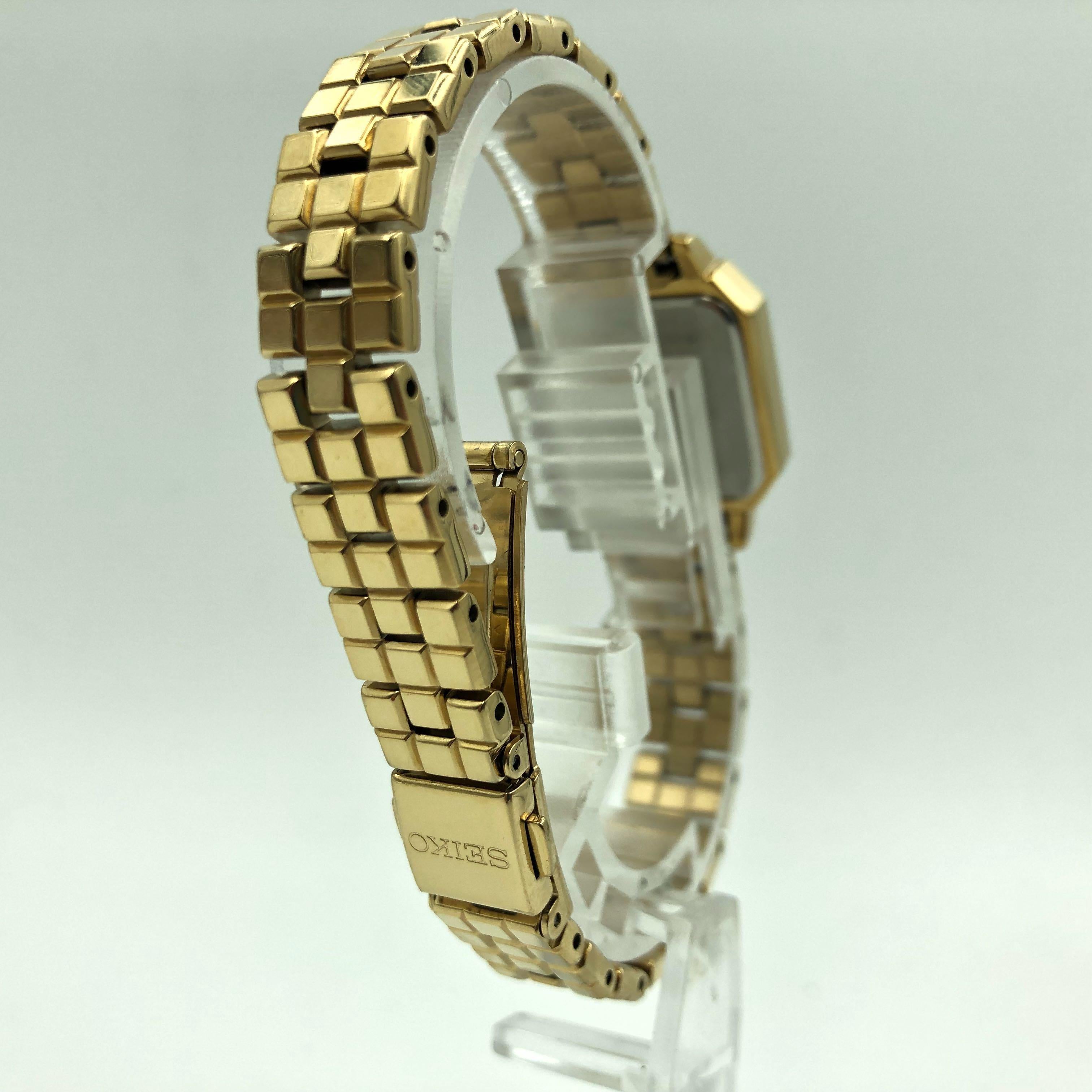 Seiko Solar Gold Tone Stainless Steel Black Dial Quartz Ladies Watch ...