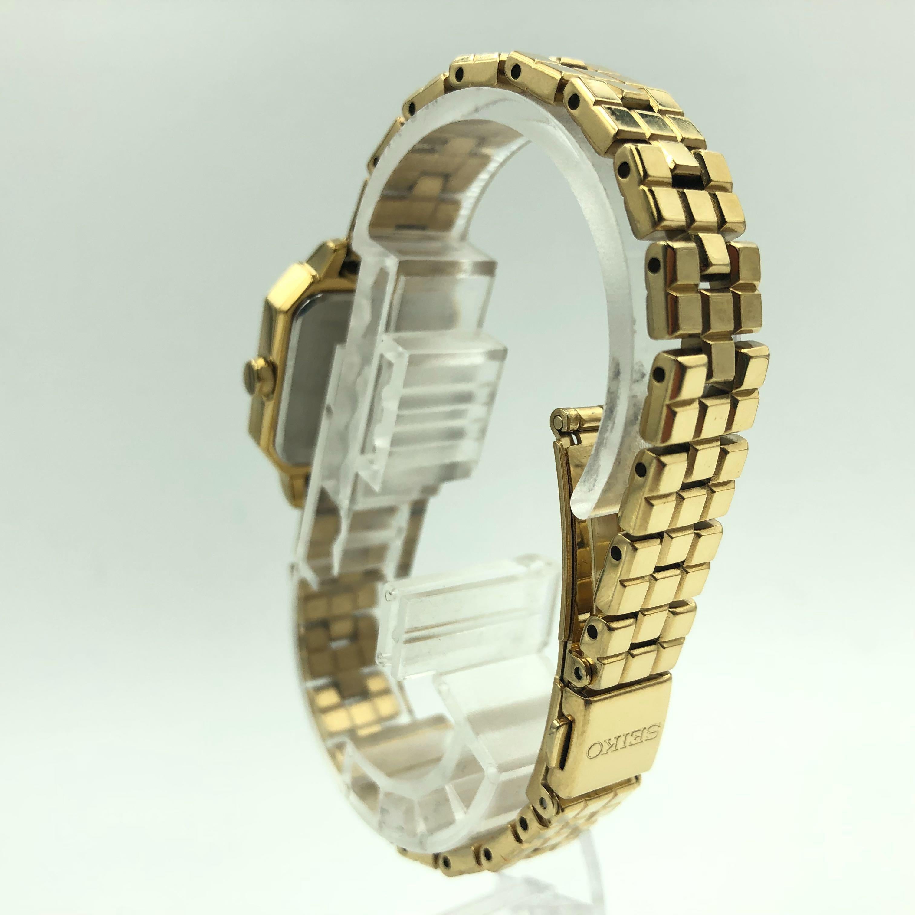 Seiko Solar Gold Tone Stainless Steel Black Dial Quartz Ladies Watch ...