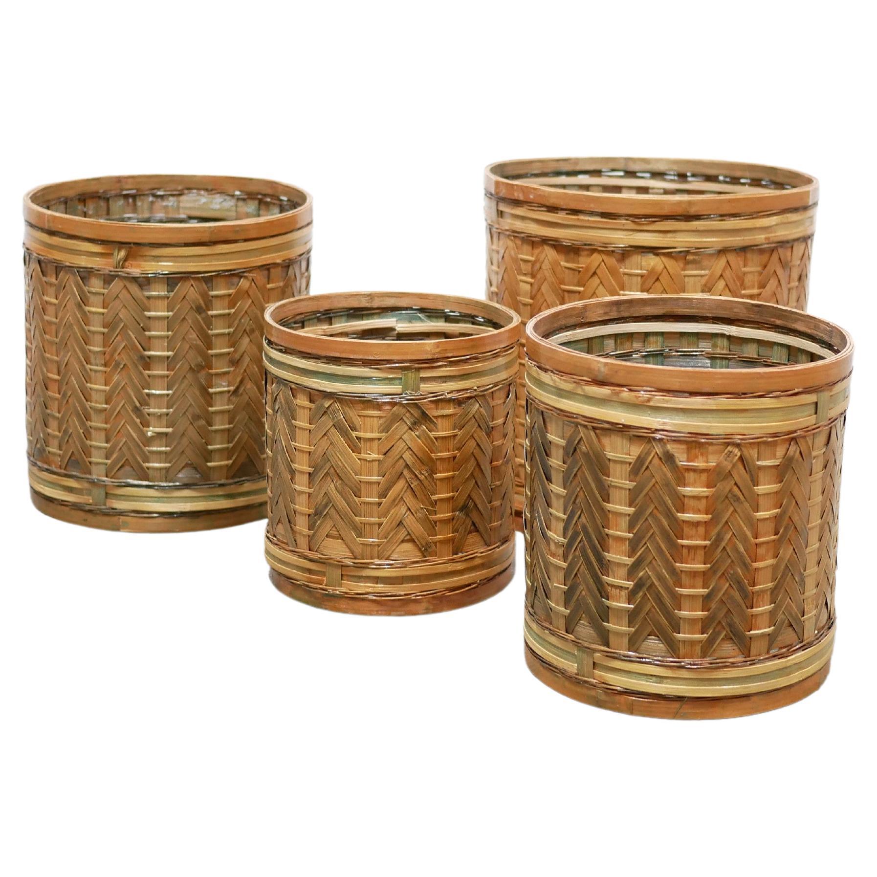 Series of 4 vintage rattan basket planters For Sale at 1stDibs