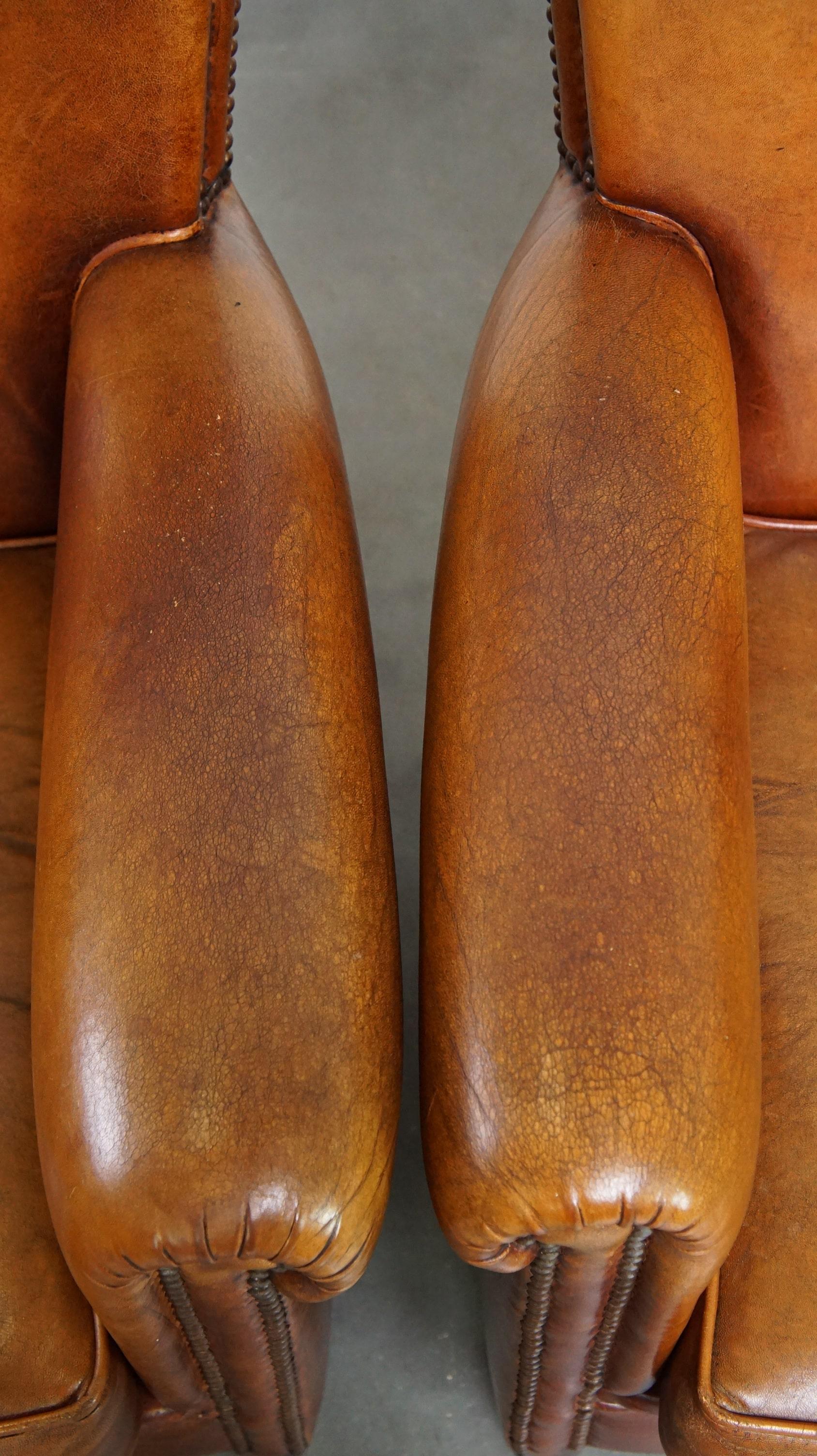 Set of 2 beautiful and comfortable sheep leather armchairs with a ...