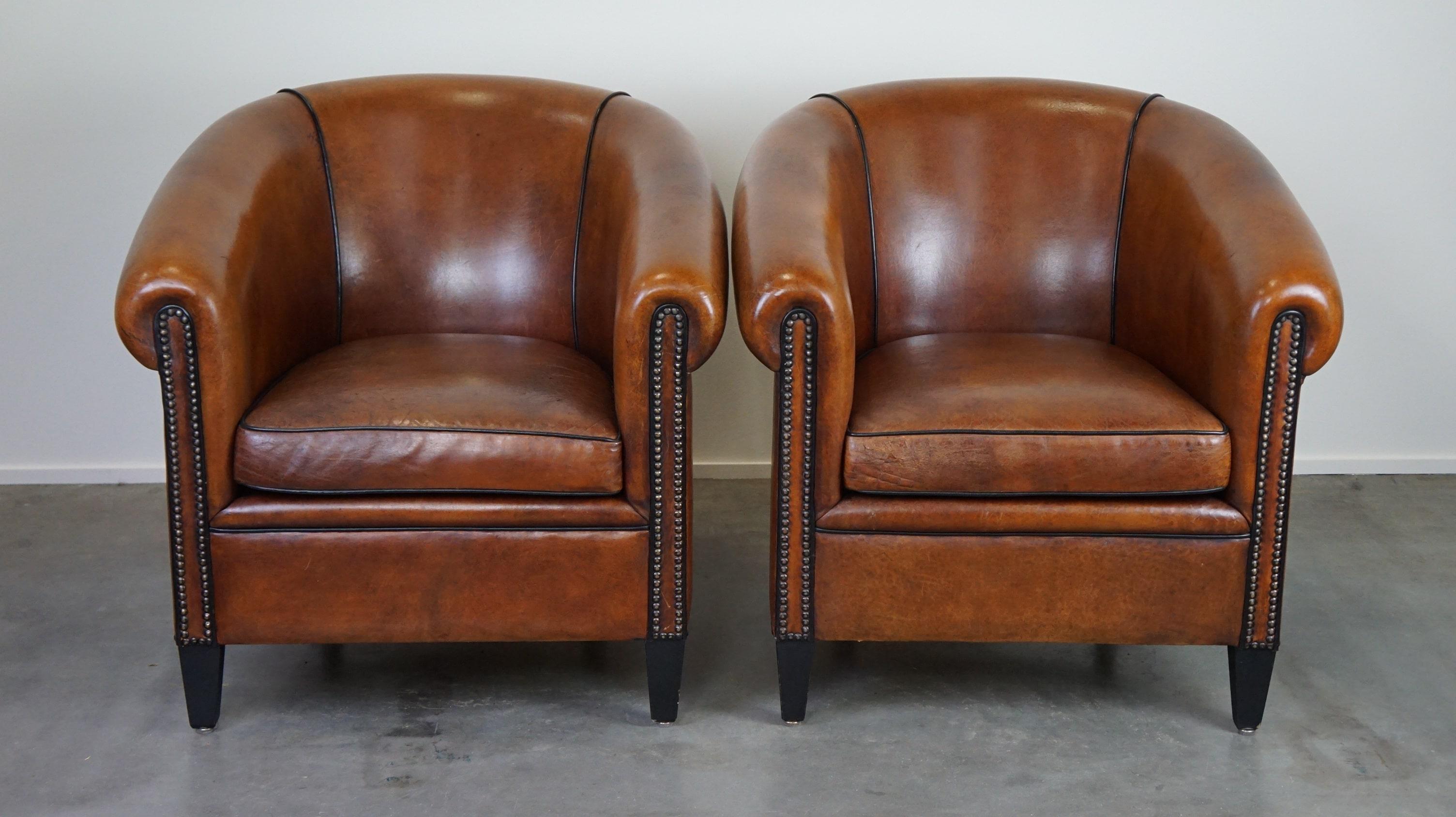 Set of 2 coveted sheepskin leather club armchairs with a beautiful ...