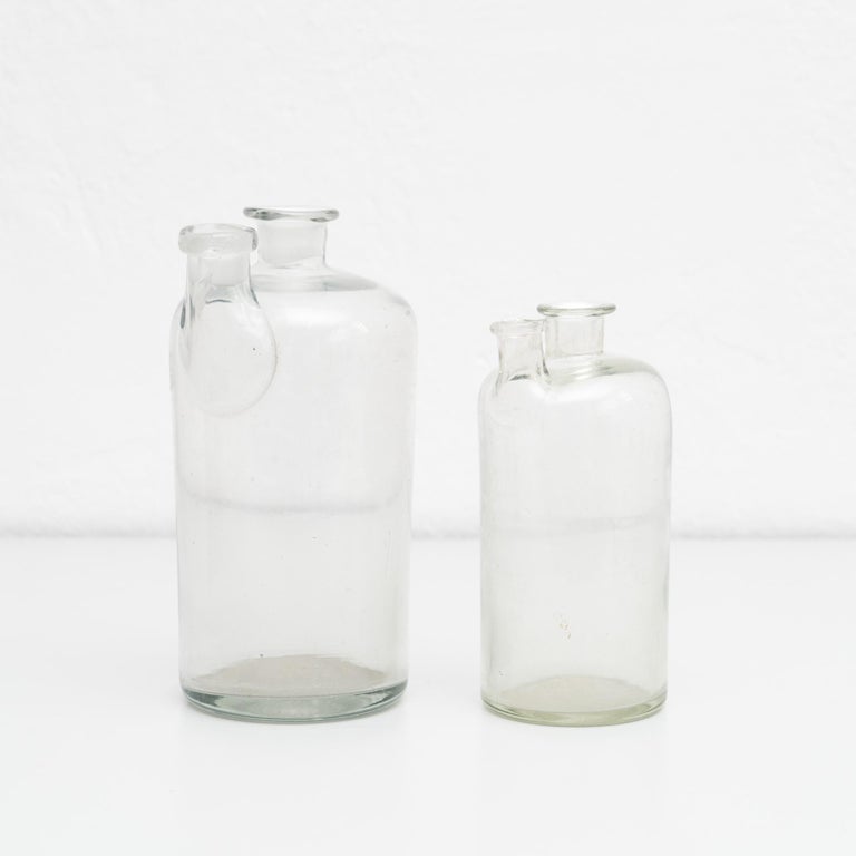 Set of 2 Early 20th Century Rustic Glass Bottles For Sale at 1stDibs