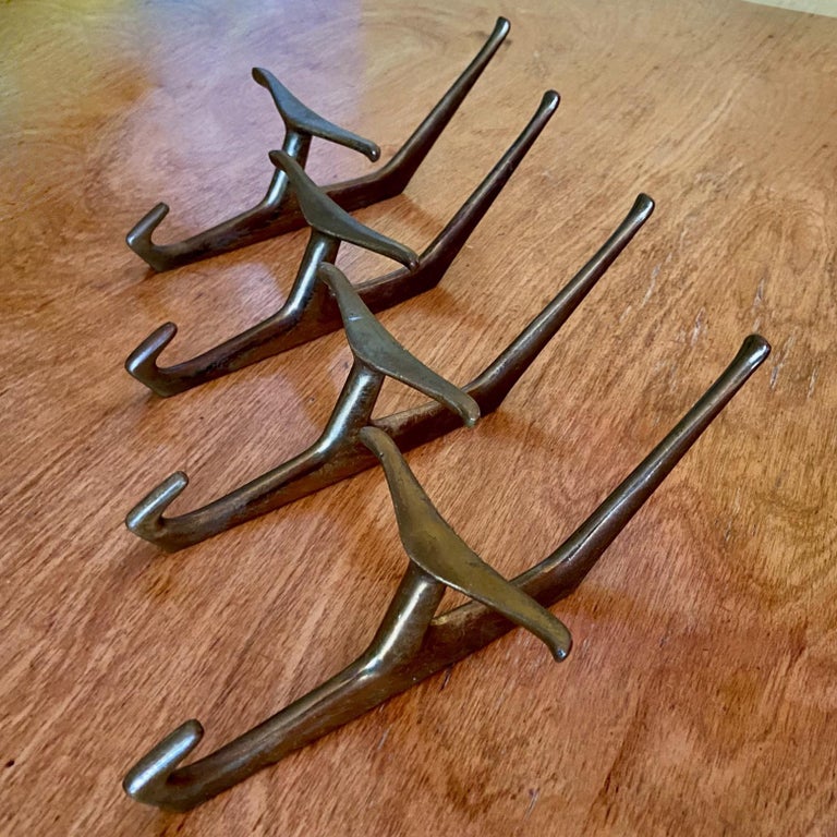 set of 4 large triple mid century brass hooks coat hangers, manner of ...