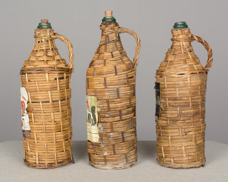 Set of 6 Wicker Wrapped Glass Bottles at 1stDibs