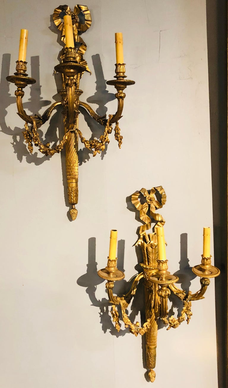 Set of Four Large Ornate Three-Light Torch and Ribbon Form Wall Sconces ...