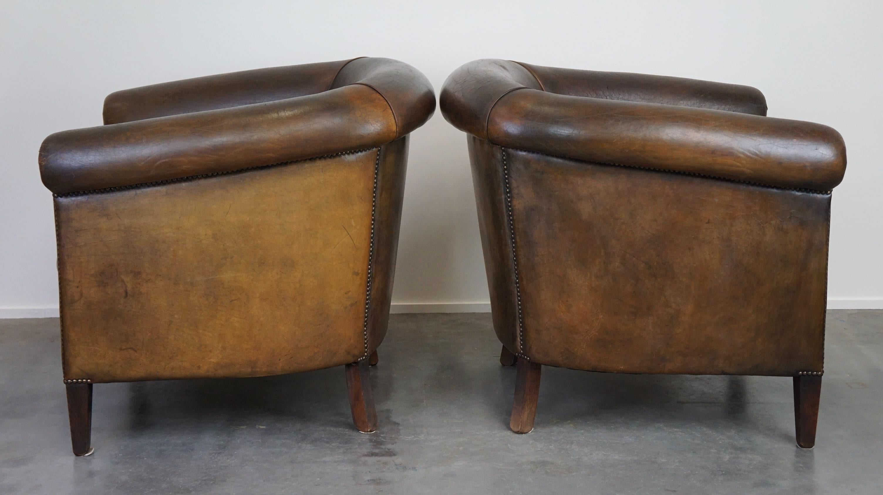 Set of two large, rugged, dark sheepskin leather club armchairs For ...
